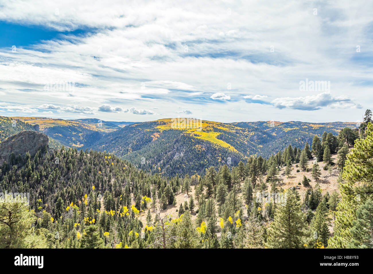 Mountain scenery with streams, valleys, and colorful trees along a ...