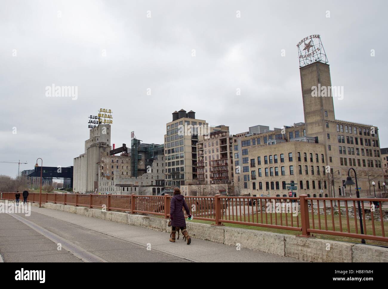 People walking on the Stone Arch bridge in Minneapolis, Minnesota, USA ...