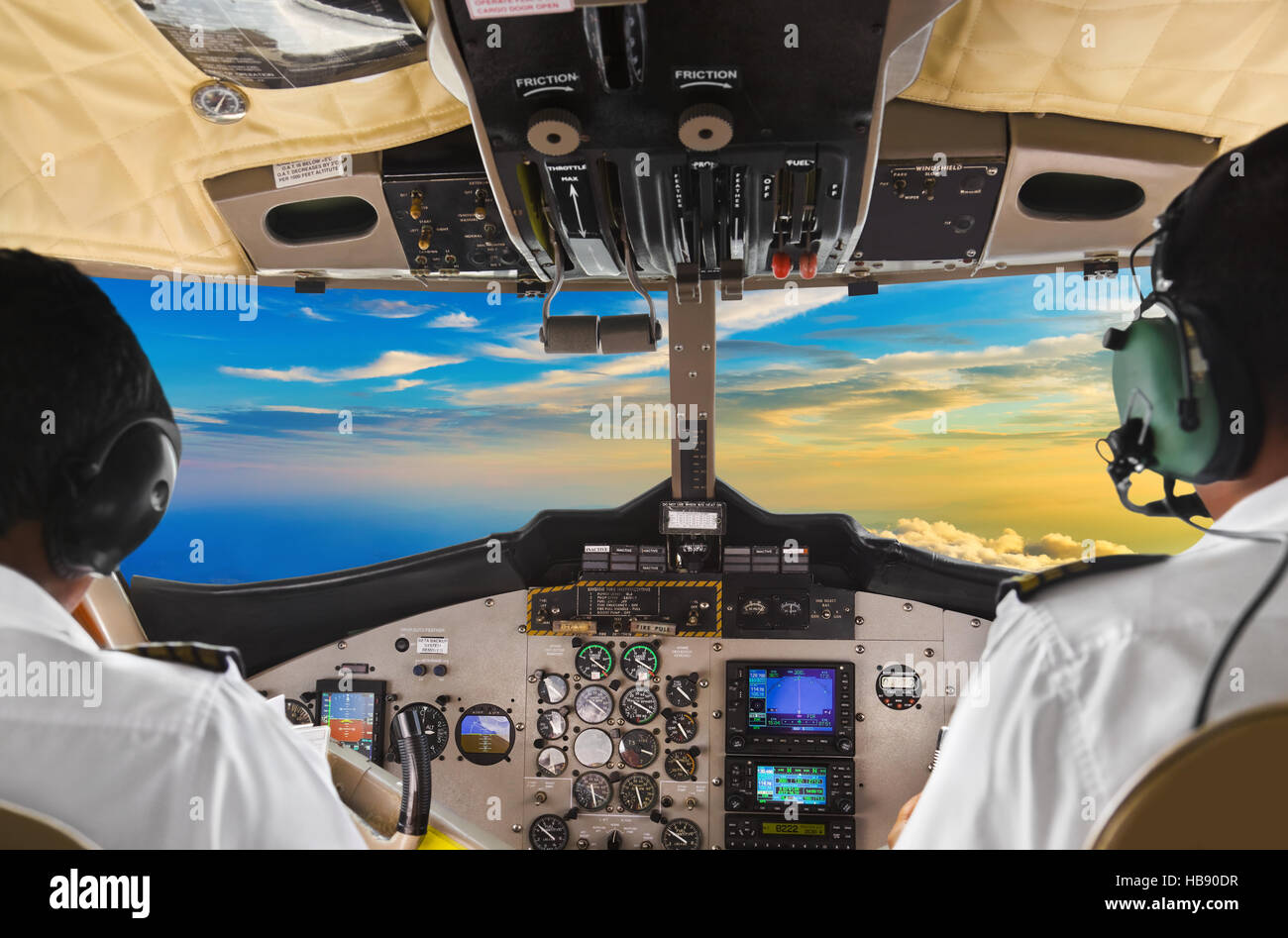 Pilots in the plane cockpit and sunset Stock Photo - Alamy