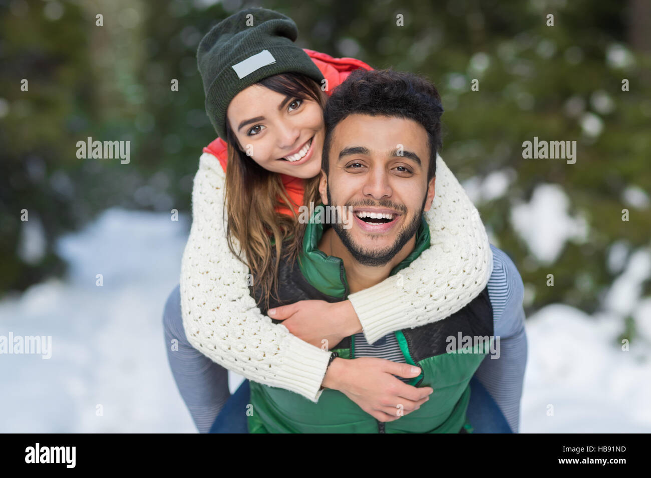Young Mix Race Couple Snow Forest Outdoor Winter Walk Stock Photo - Alamy
