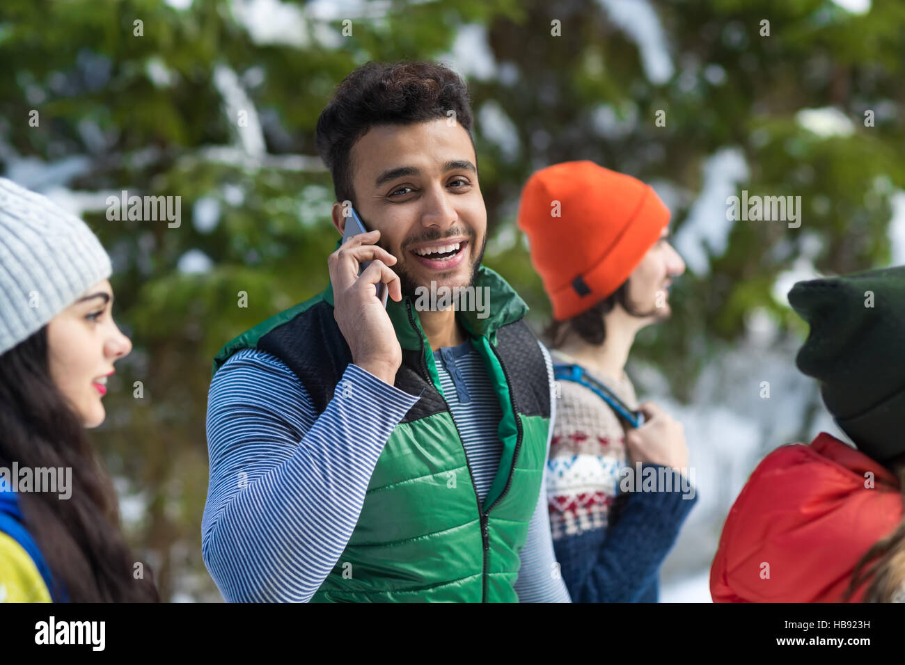 Hispanic Man Using Smart Phone Call Snow Forest Young People Group ...