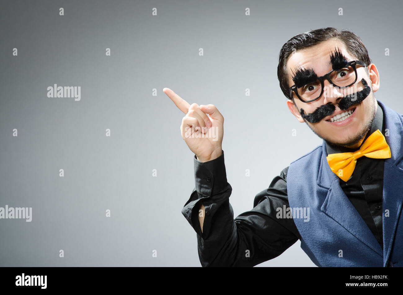 Funny man against dark background Stock Photo - Alamy
