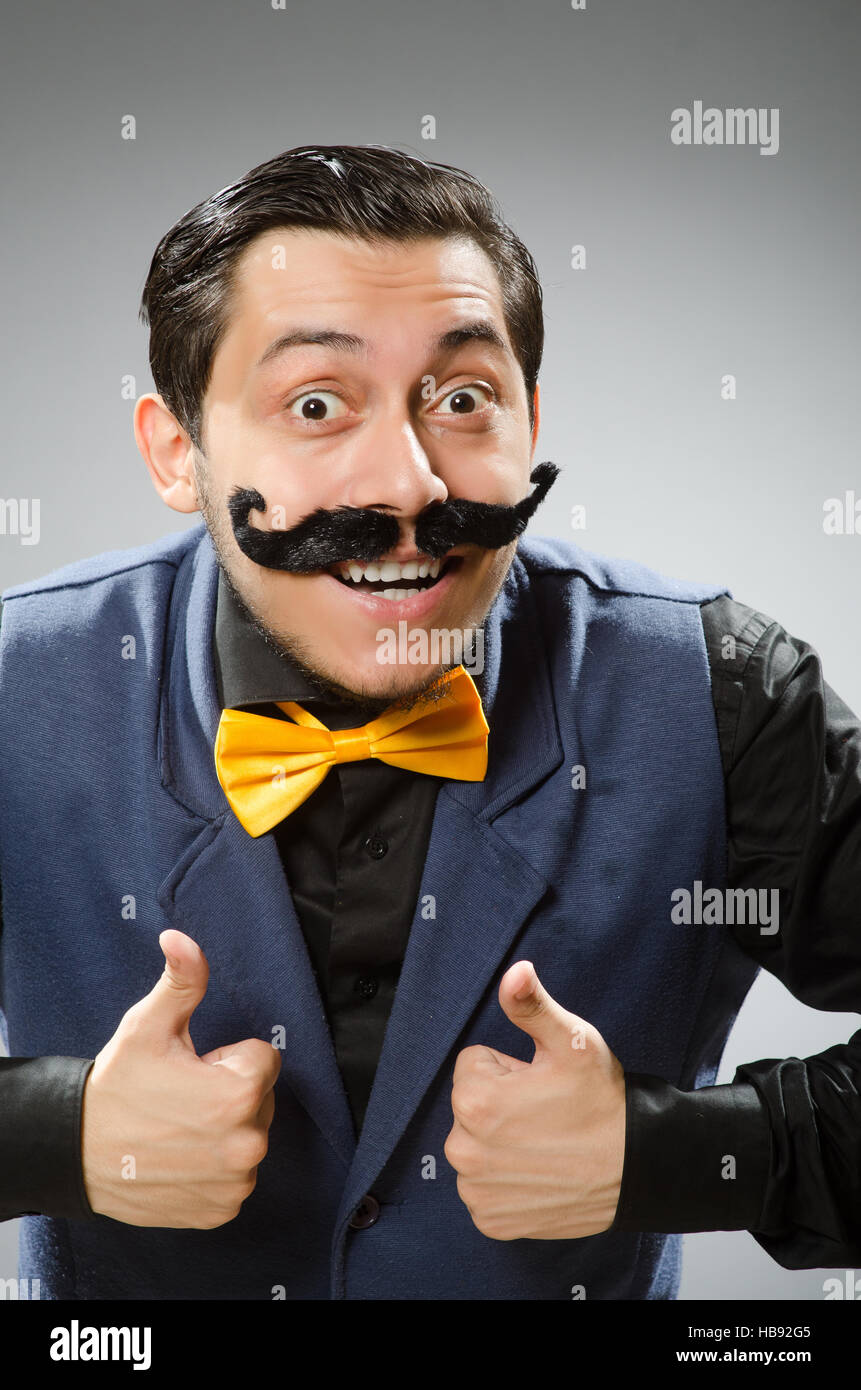 Funny man against dark background Stock Photo - Alamy