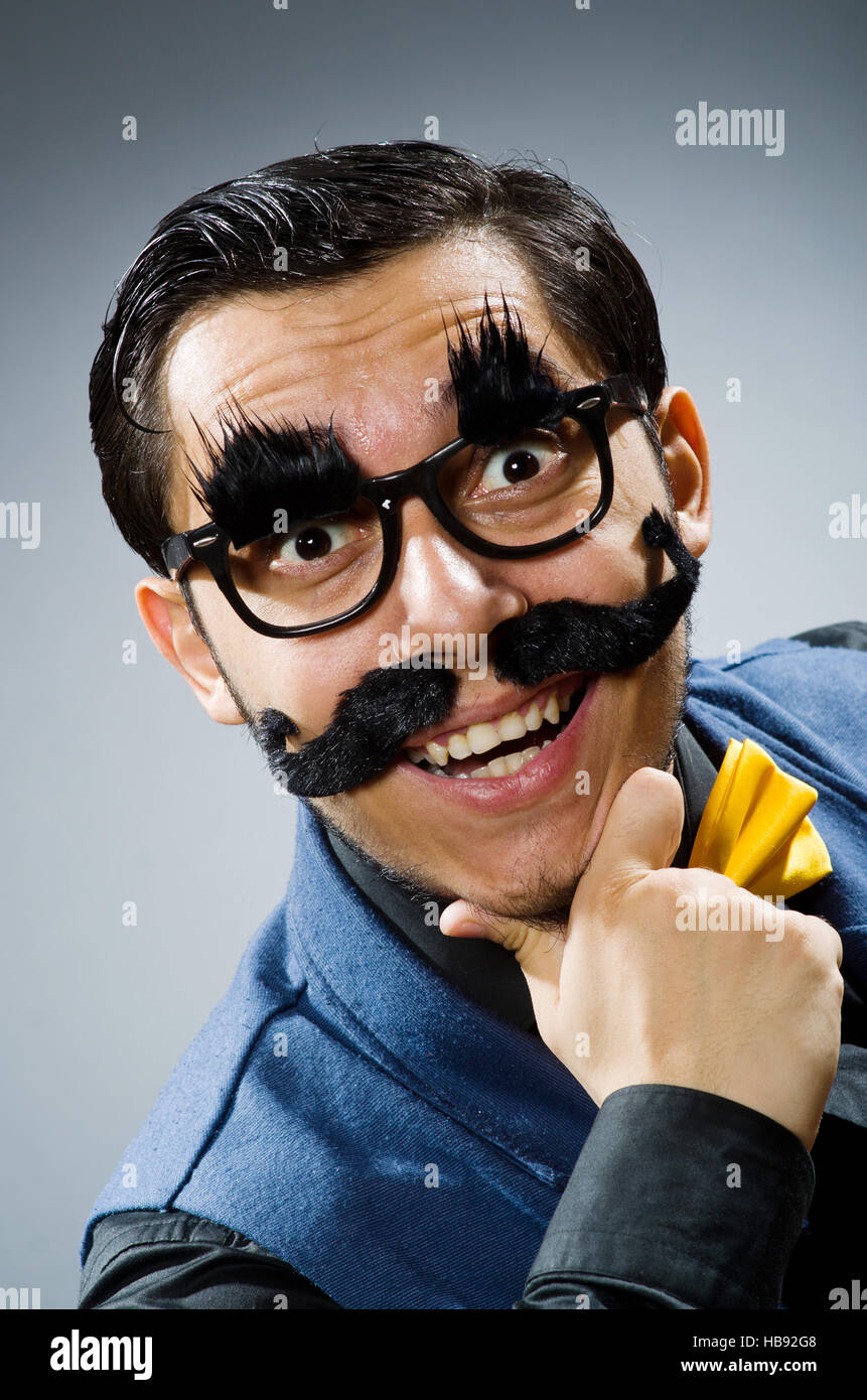 Funny man against dark background Stock Photo - Alamy