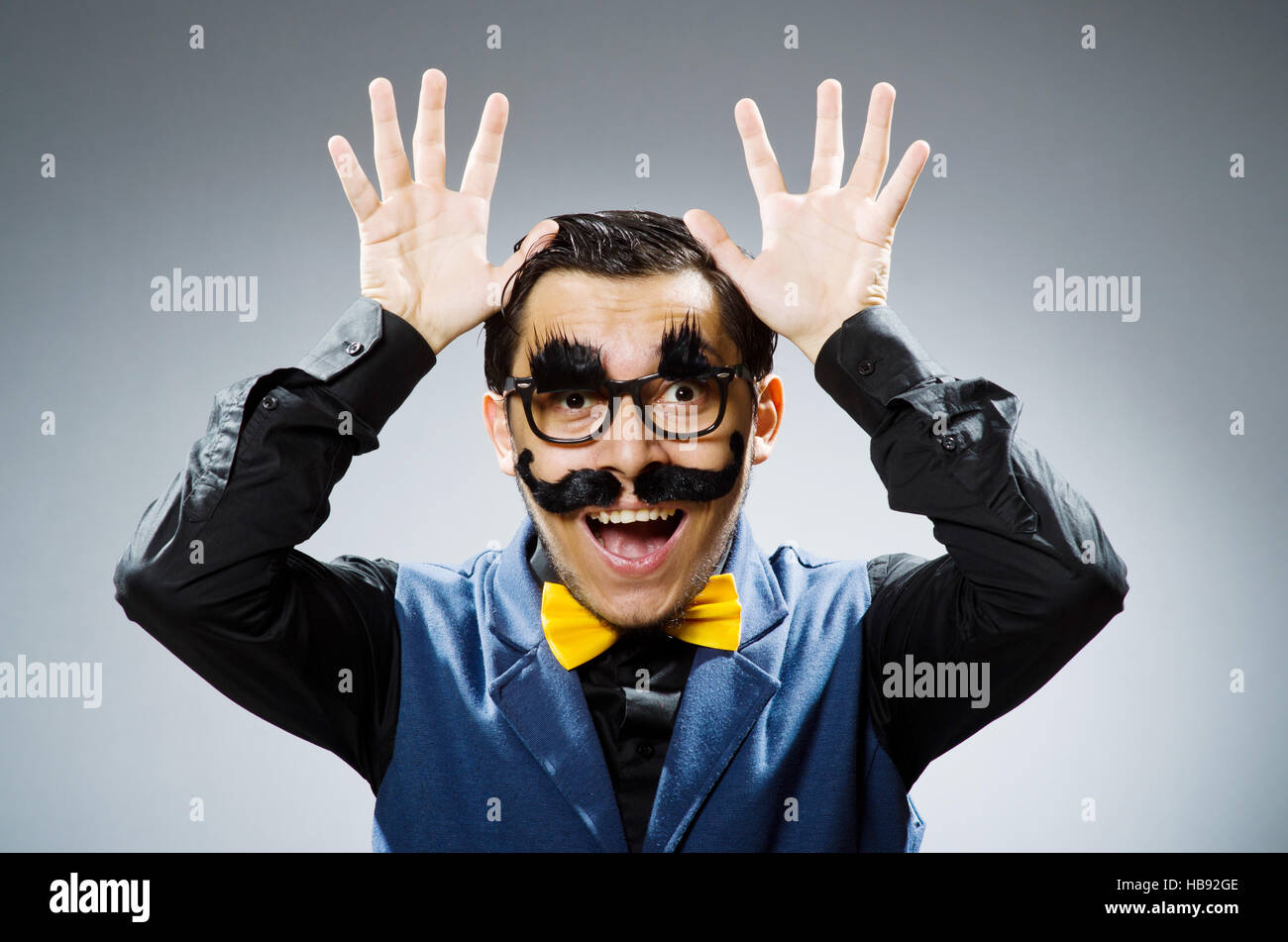 Funny man against dark background Stock Photo - Alamy