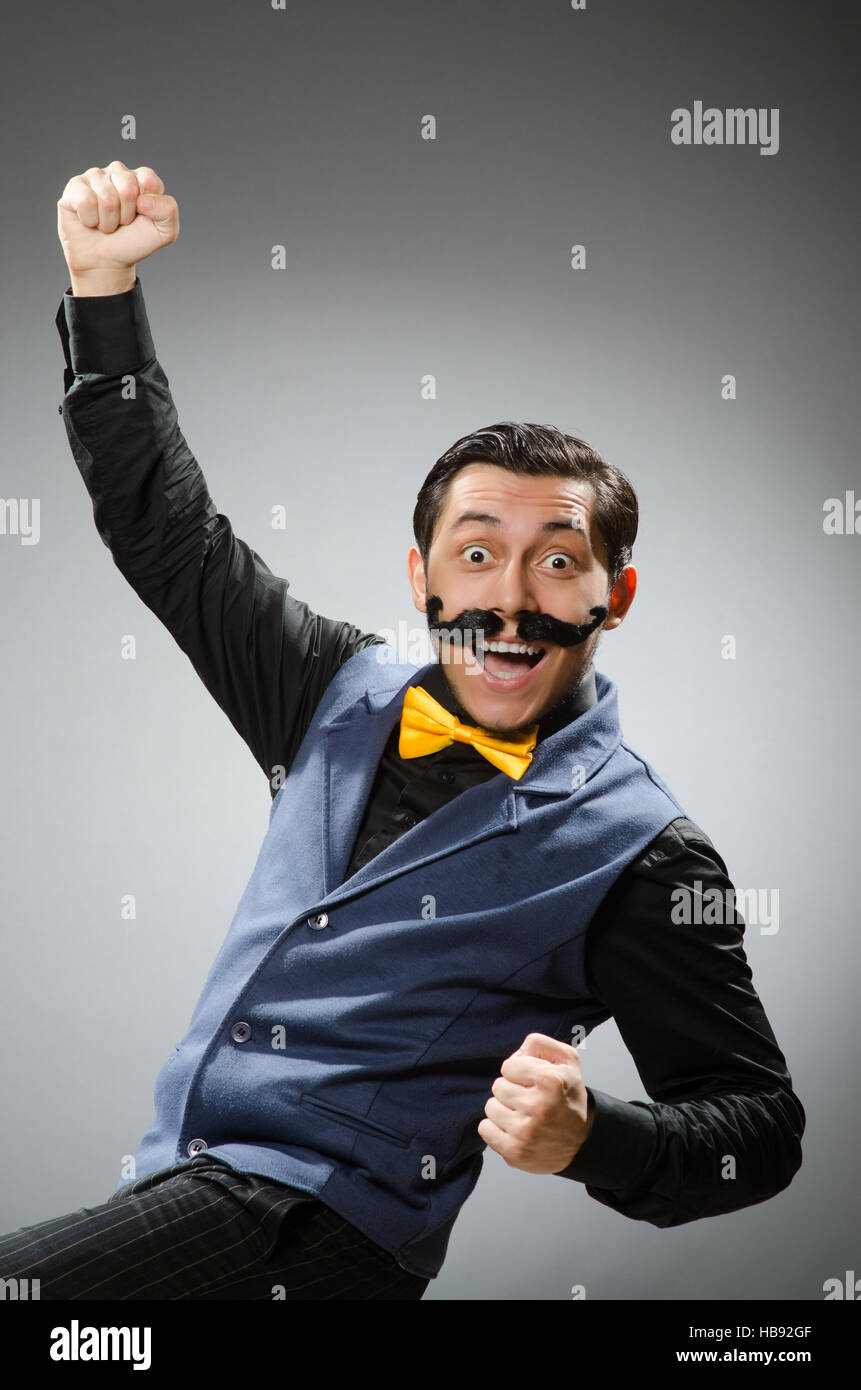 Funny man against dark background Stock Photo - Alamy