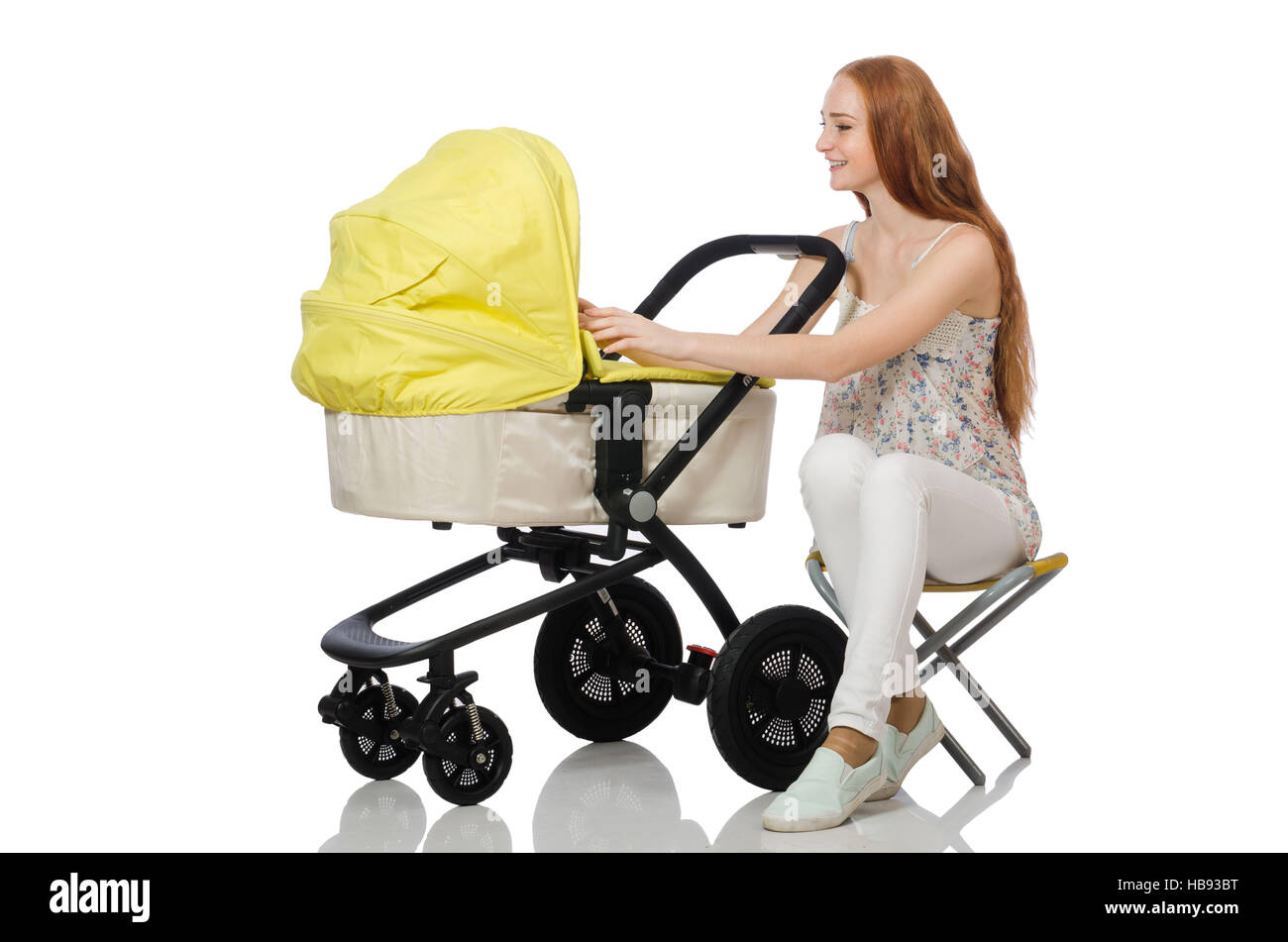 Woman with baby and pram isolated on white Stock Photo - Alamy