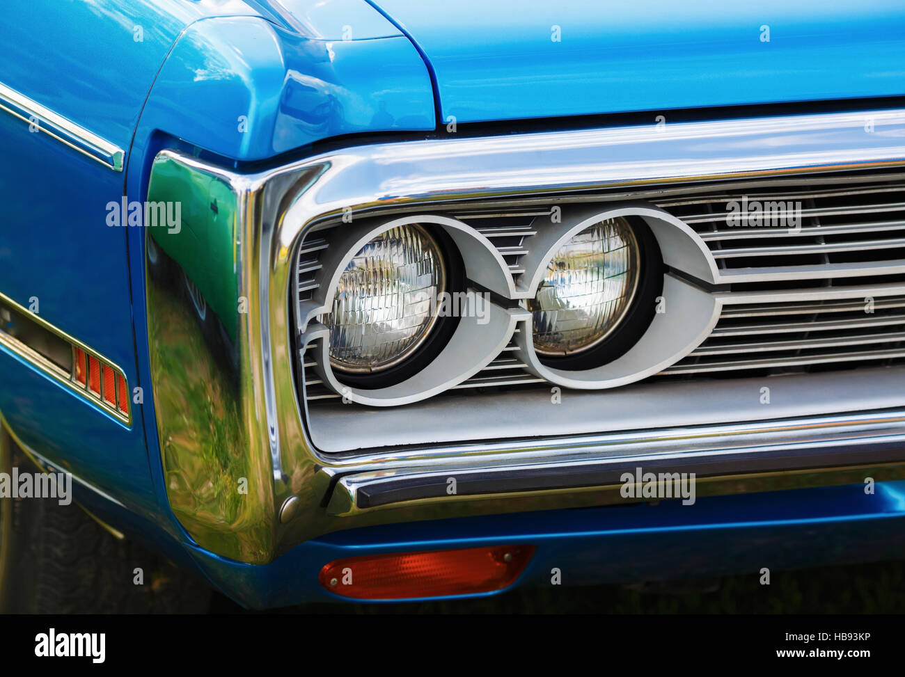 Headlights of blue car Stock Photo - Alamy