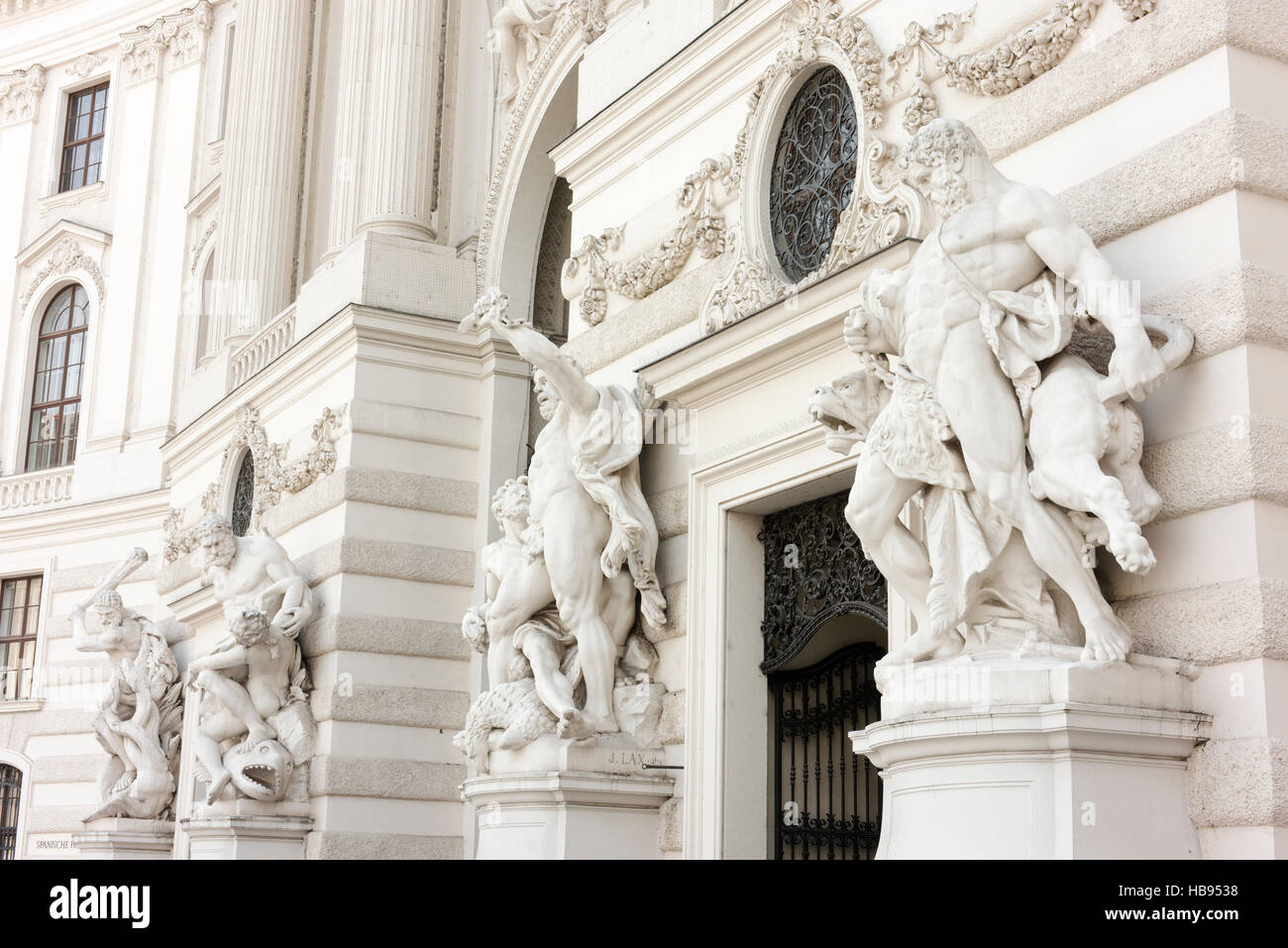 Statues decorate a building on Michaelerplatz Stock Photo - Alamy