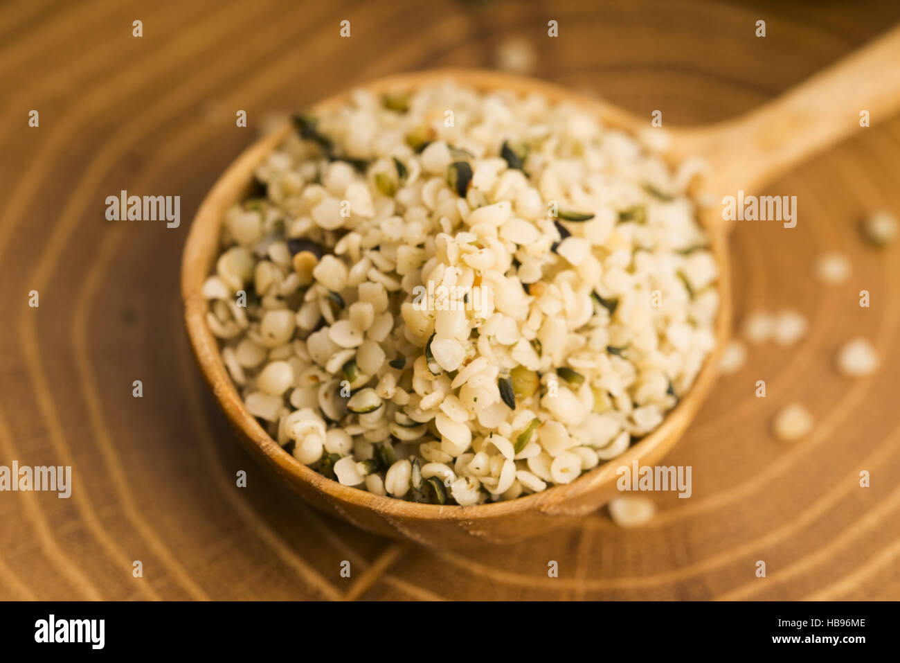 Shelled hemp seeds on wood background Stock Photo - Alamy