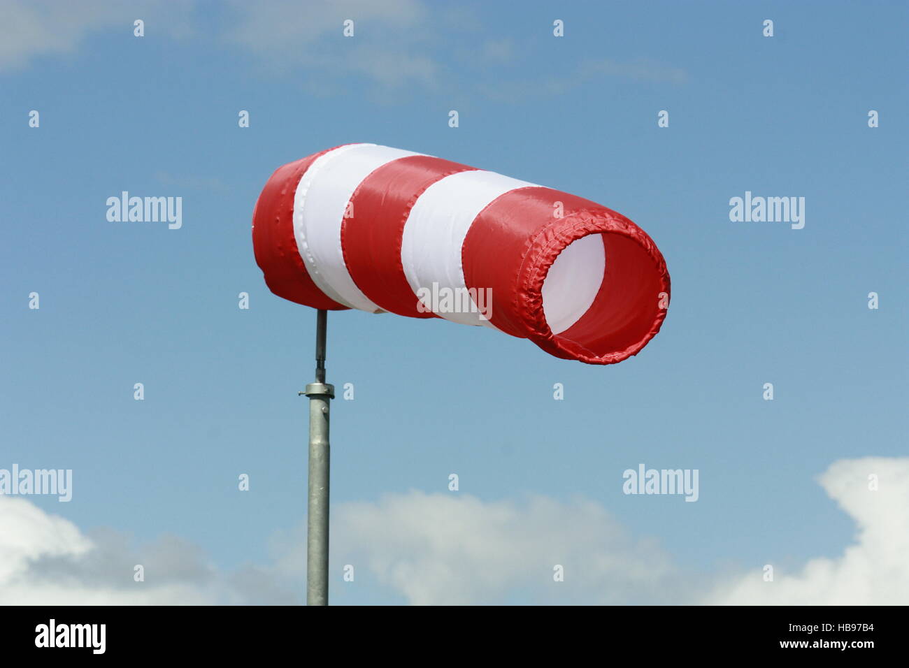 Windsock in the wind, red white Stock Photo - Alamy