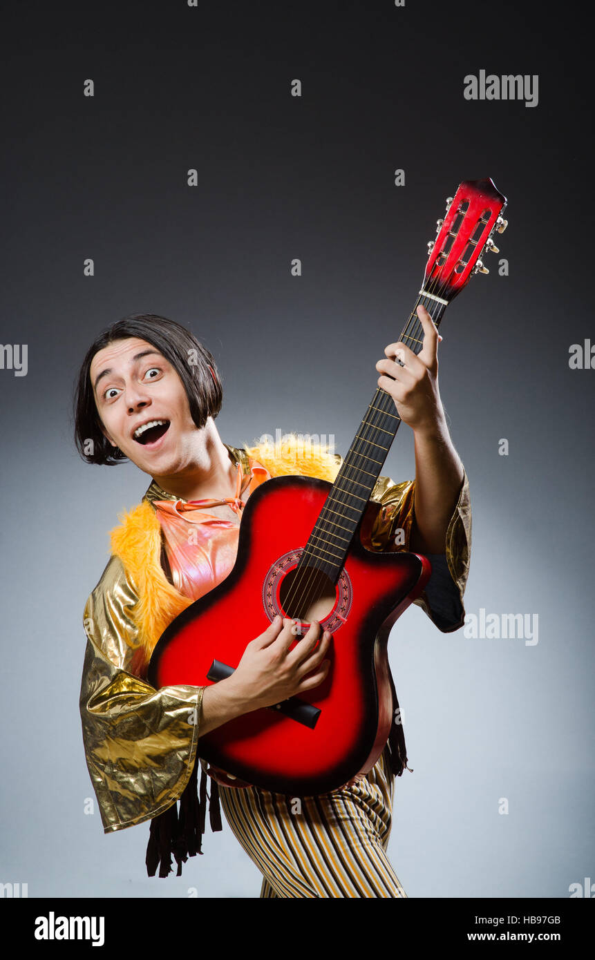 Man with guitar in musical concept Stock Photo - Alamy
