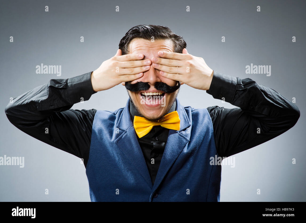 Funny man against dark background Stock Photo - Alamy