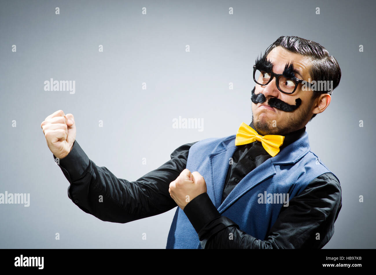 Funny man against dark background Stock Photo - Alamy