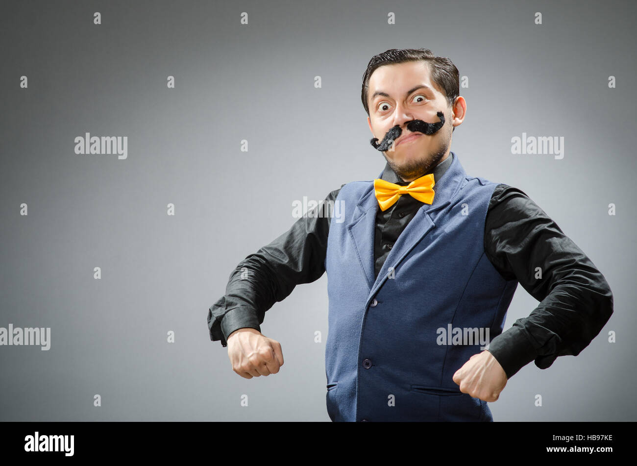 Funny man against dark background Stock Photo - Alamy