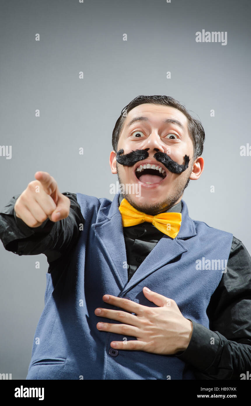 Funny man against dark background Stock Photo - Alamy