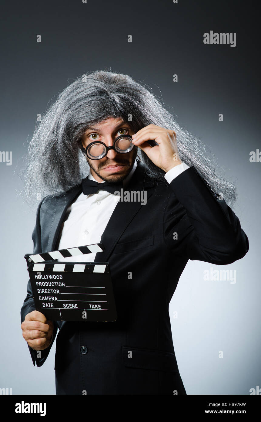 Funny man with movie clapboard Stock Photo - Alamy