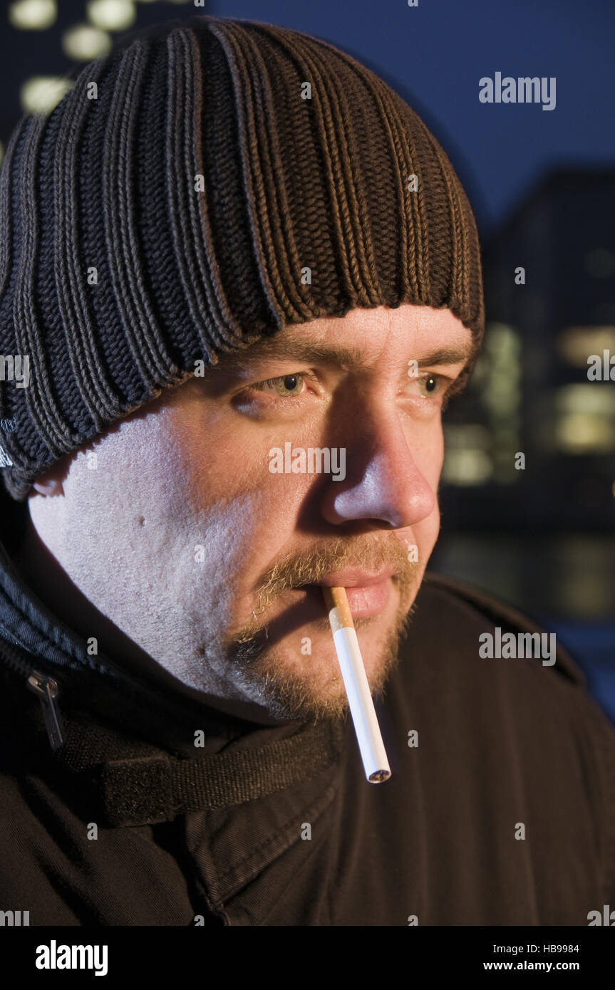 smoking man in the night Stock Photo - Alamy