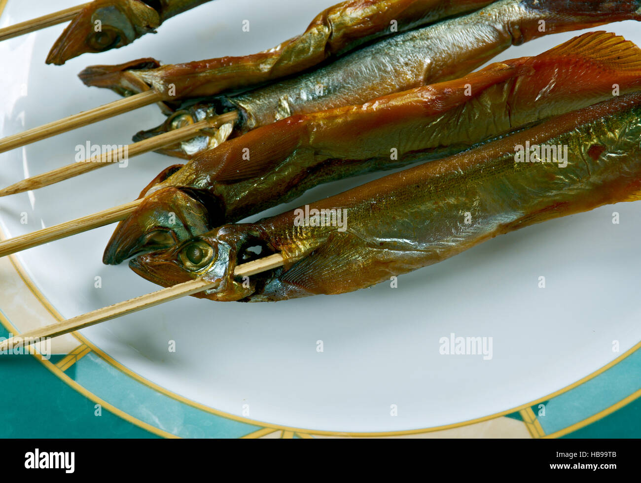 grilled fish on a stick Stock Photo - Alamy