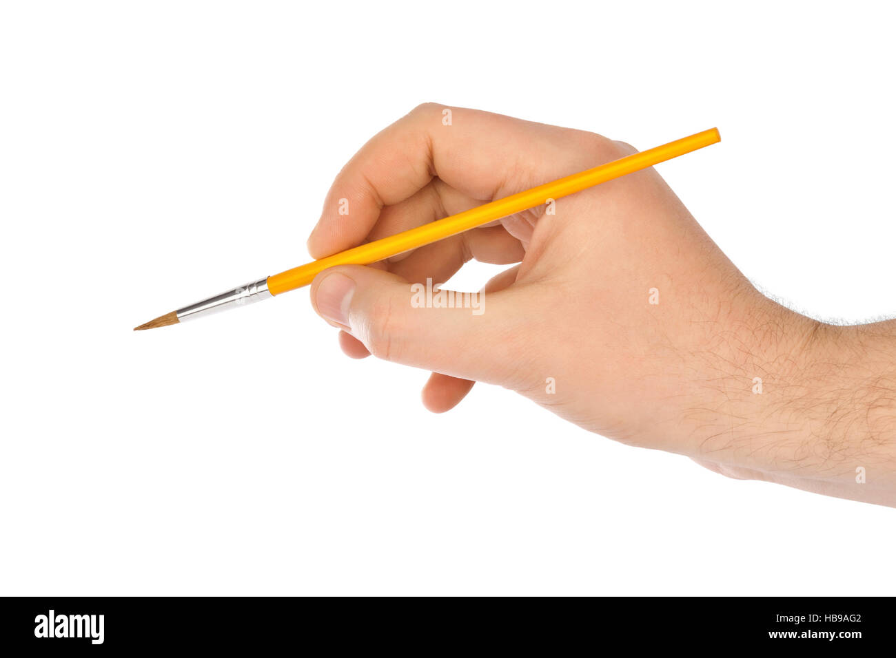 Hand holding brush brushing Cut Out Stock Images & Pictures - Alamy