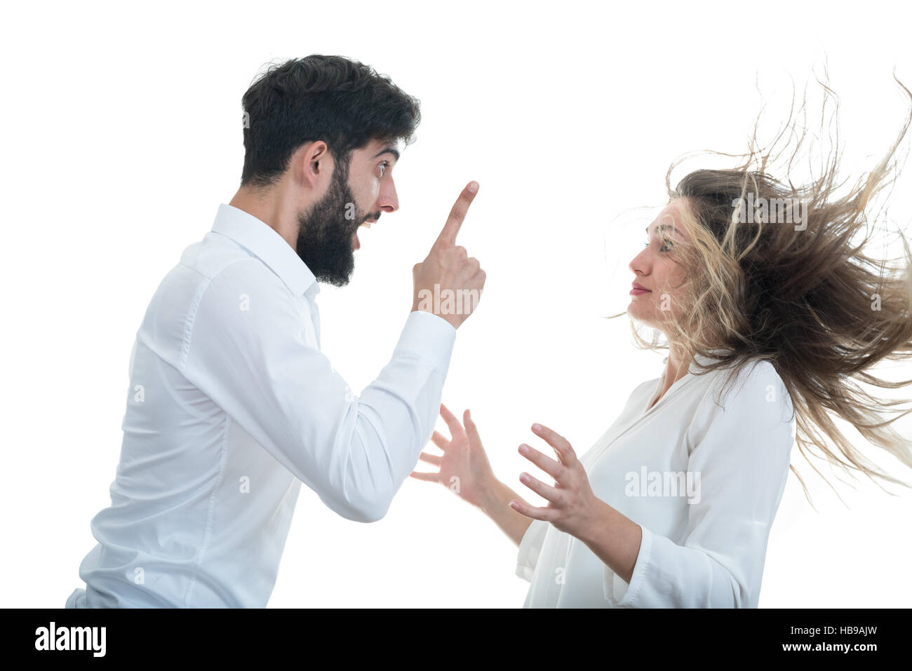 Angry couple shouting at each other on white background Stock Photo - Alamy