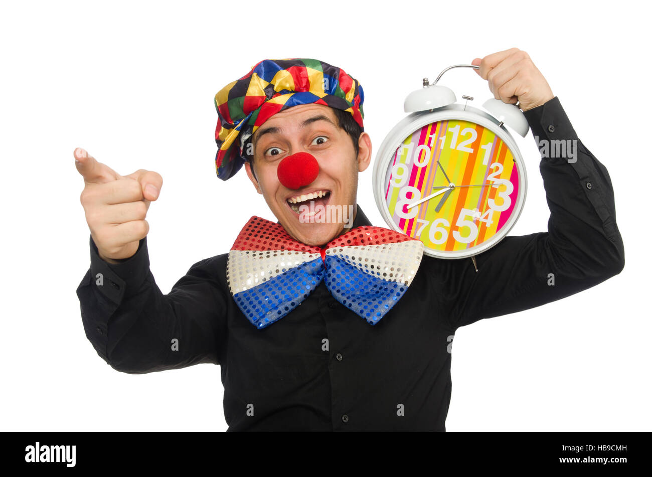 Funny clown with clock isolated on white Stock Photo - Alamy
