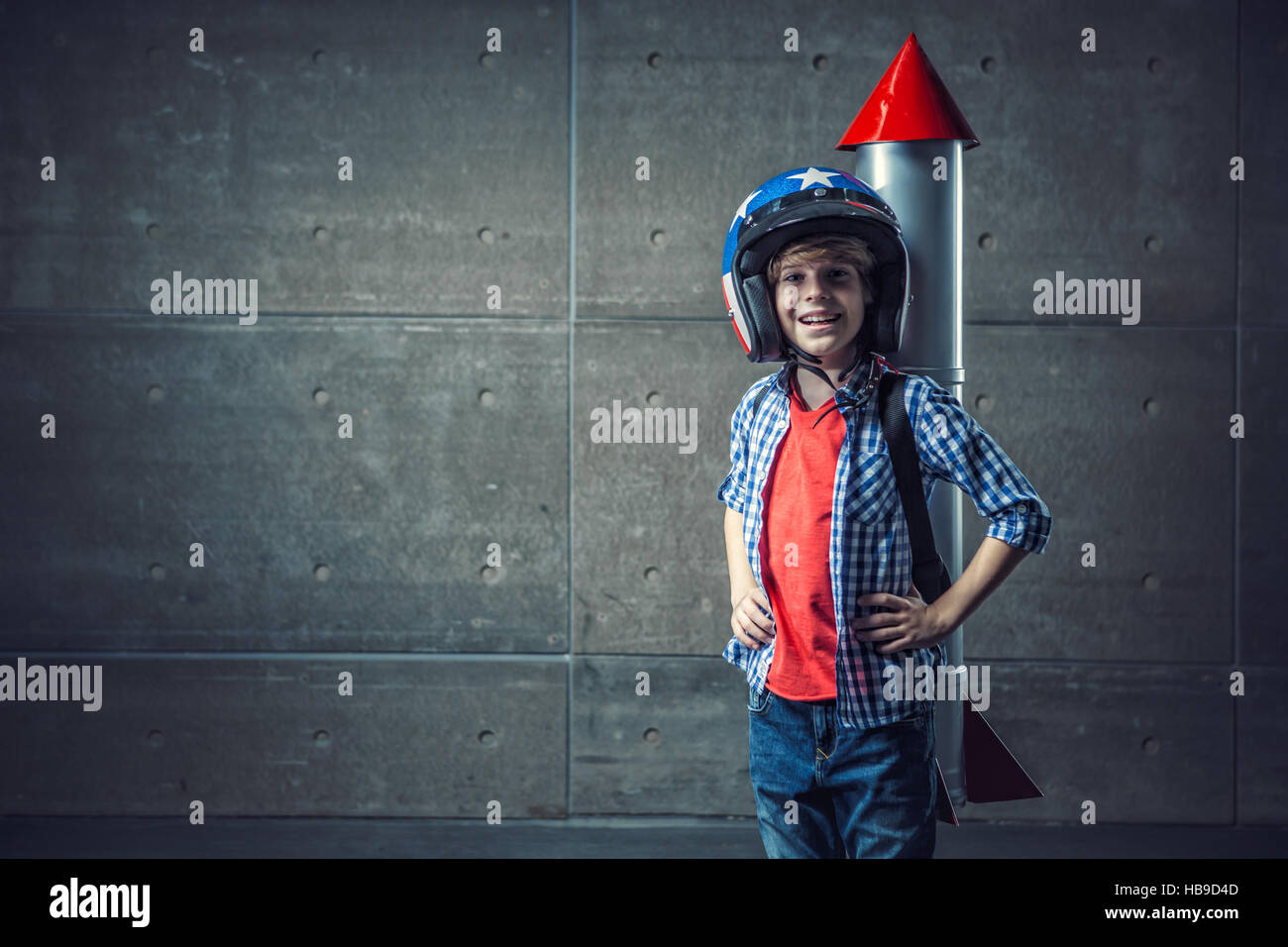 Happy boy with rocket Stock Photo - Alamy