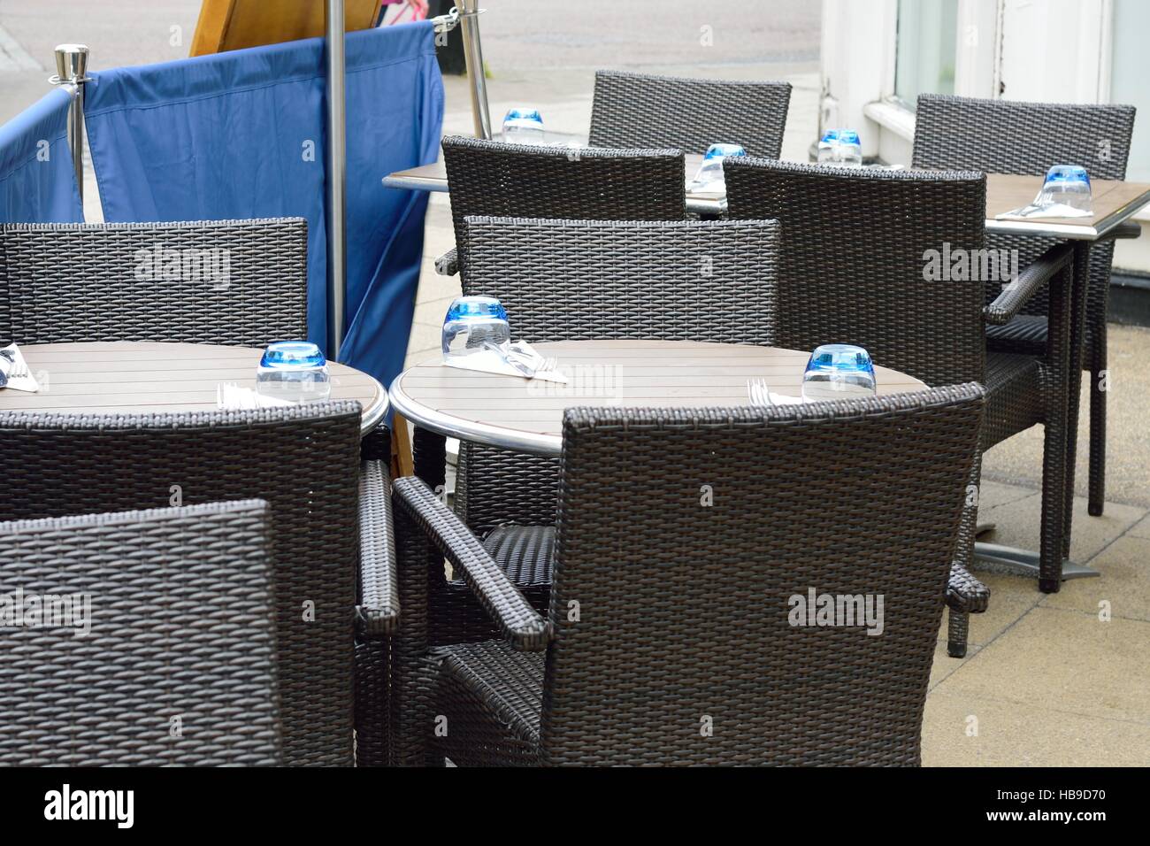 Empty Outdoor Rattan Dining Tables Stock Photo - Alamy