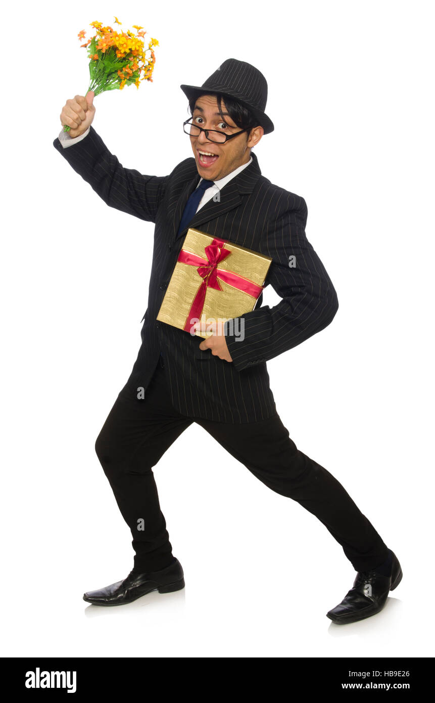 Funny man with flowers and giftbox Stock Photo - Alamy