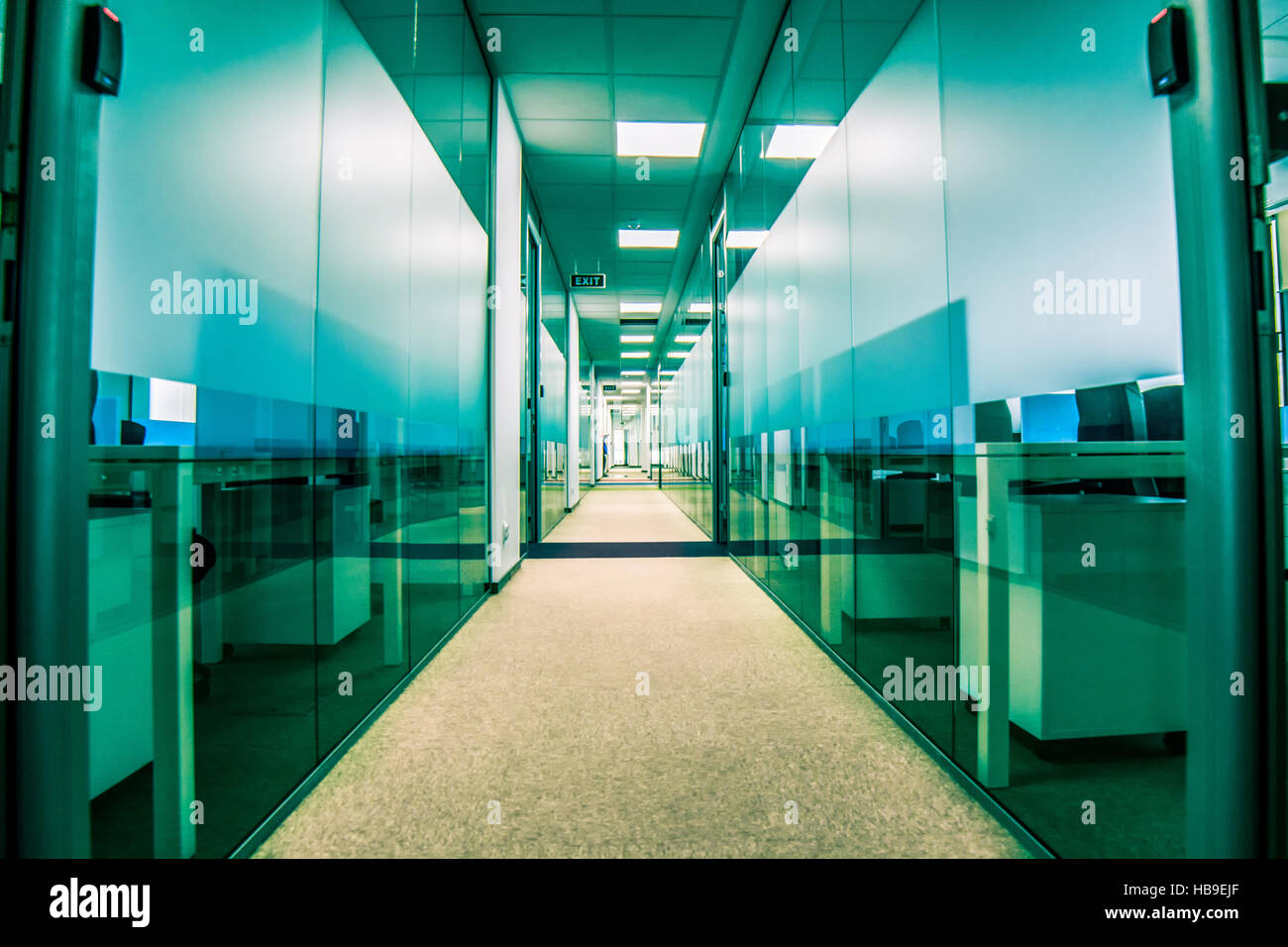 Long corridor with offices on left and right Stock Photo - Alamy