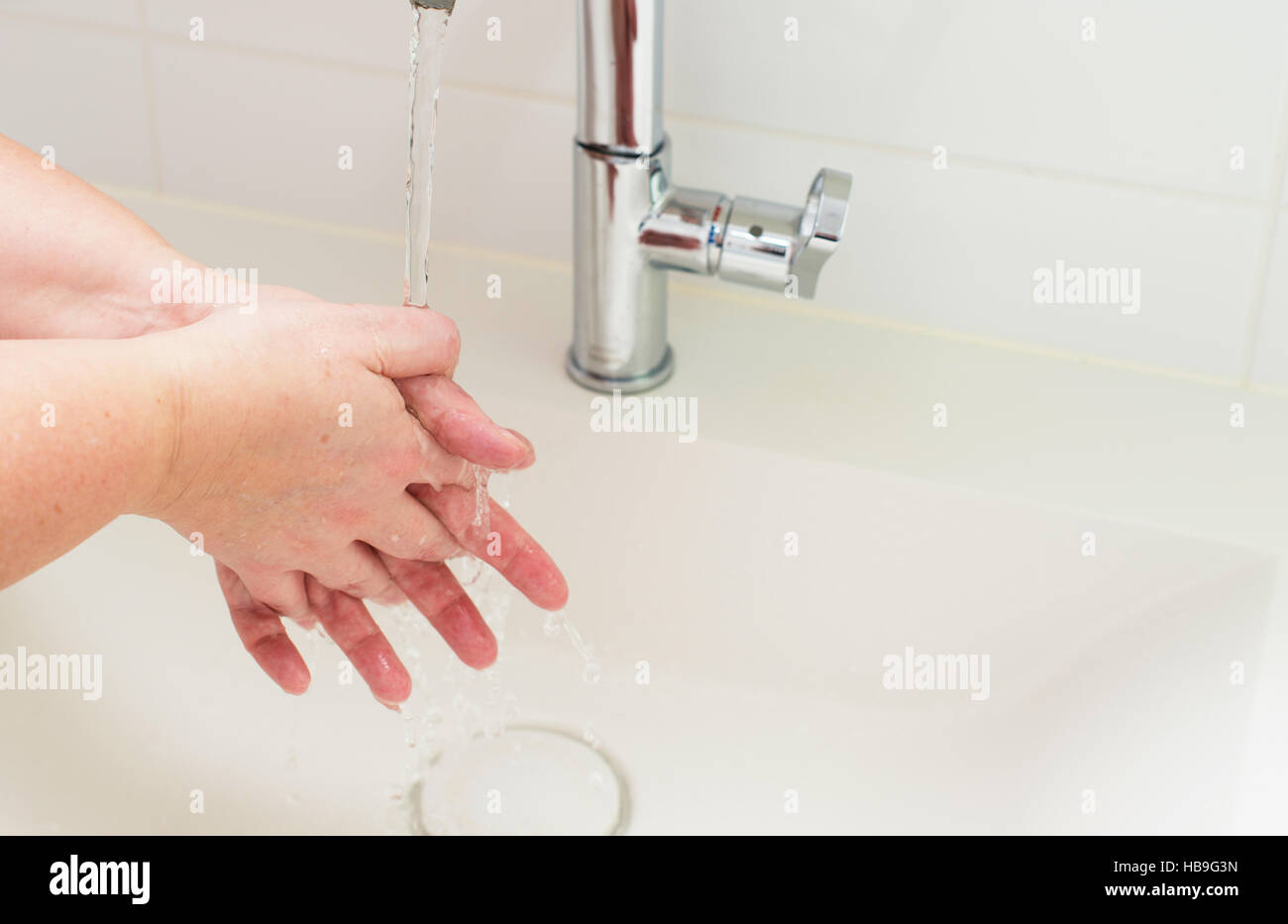 Hand running water hi-res stock photography and images - Alamy