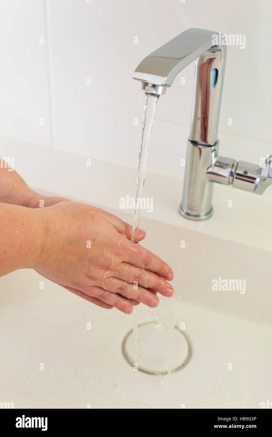 Hand Under Running Water Tap