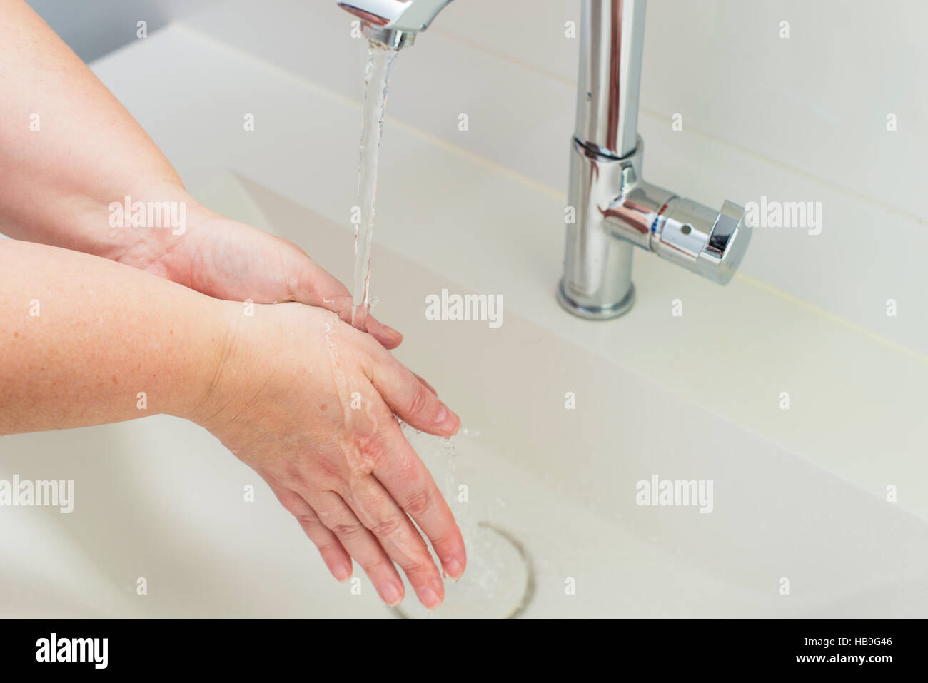 washing hand under running water Stock Photo - Alamy