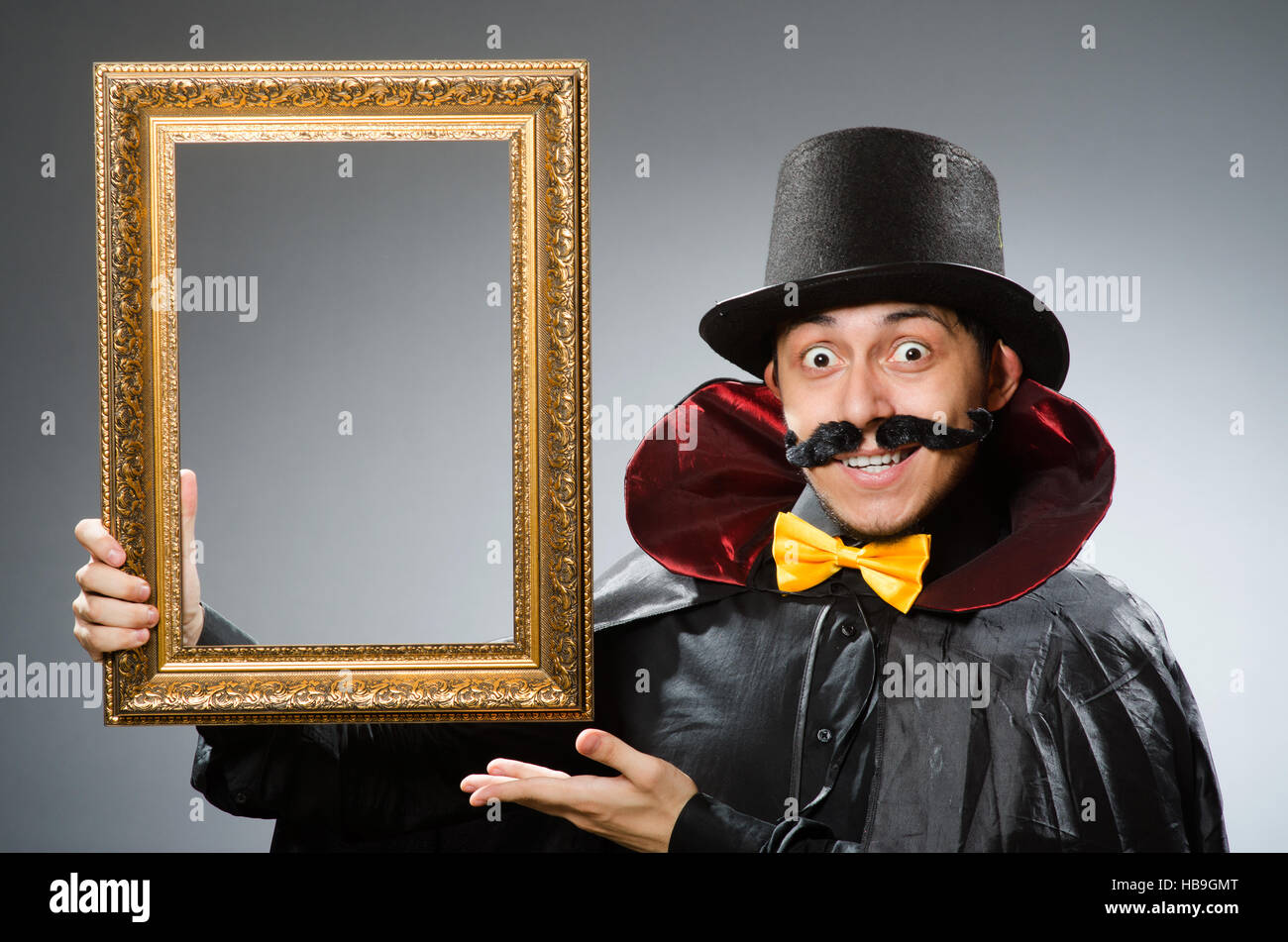 Funny man with picture frame Stock Photo - Alamy