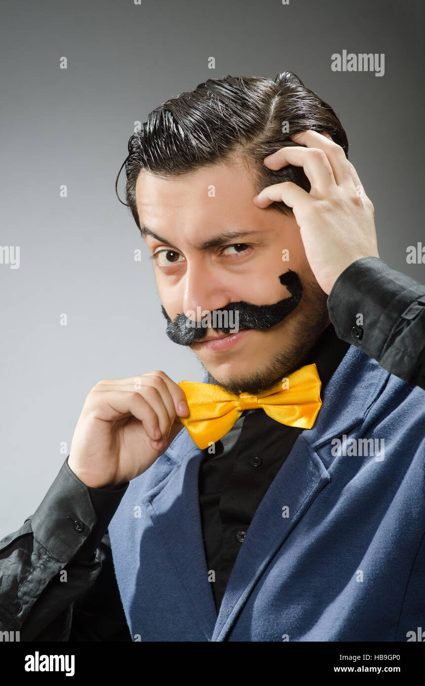 Funny man against dark background Stock Photo - Alamy
