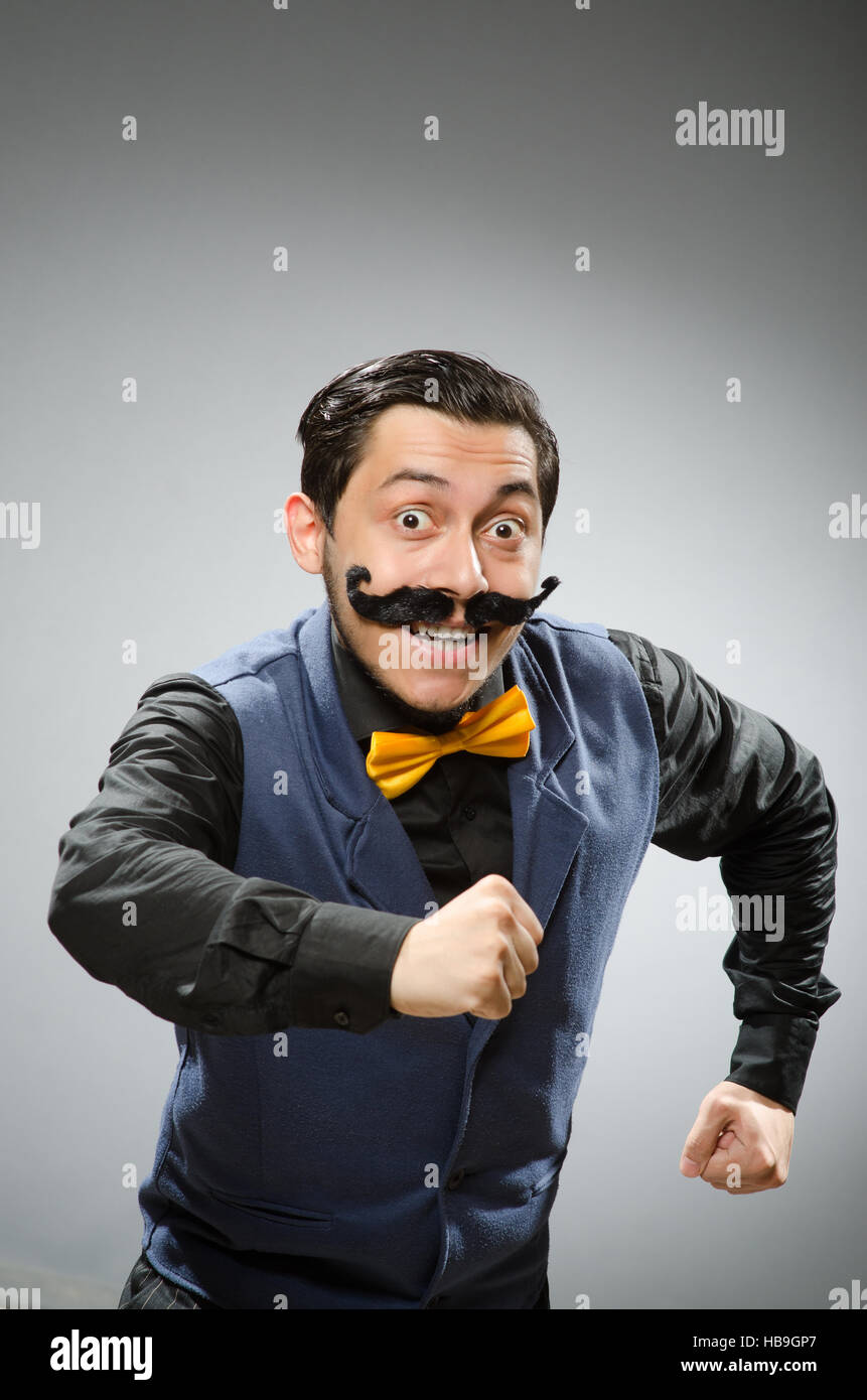 Funny man against dark background Stock Photo - Alamy