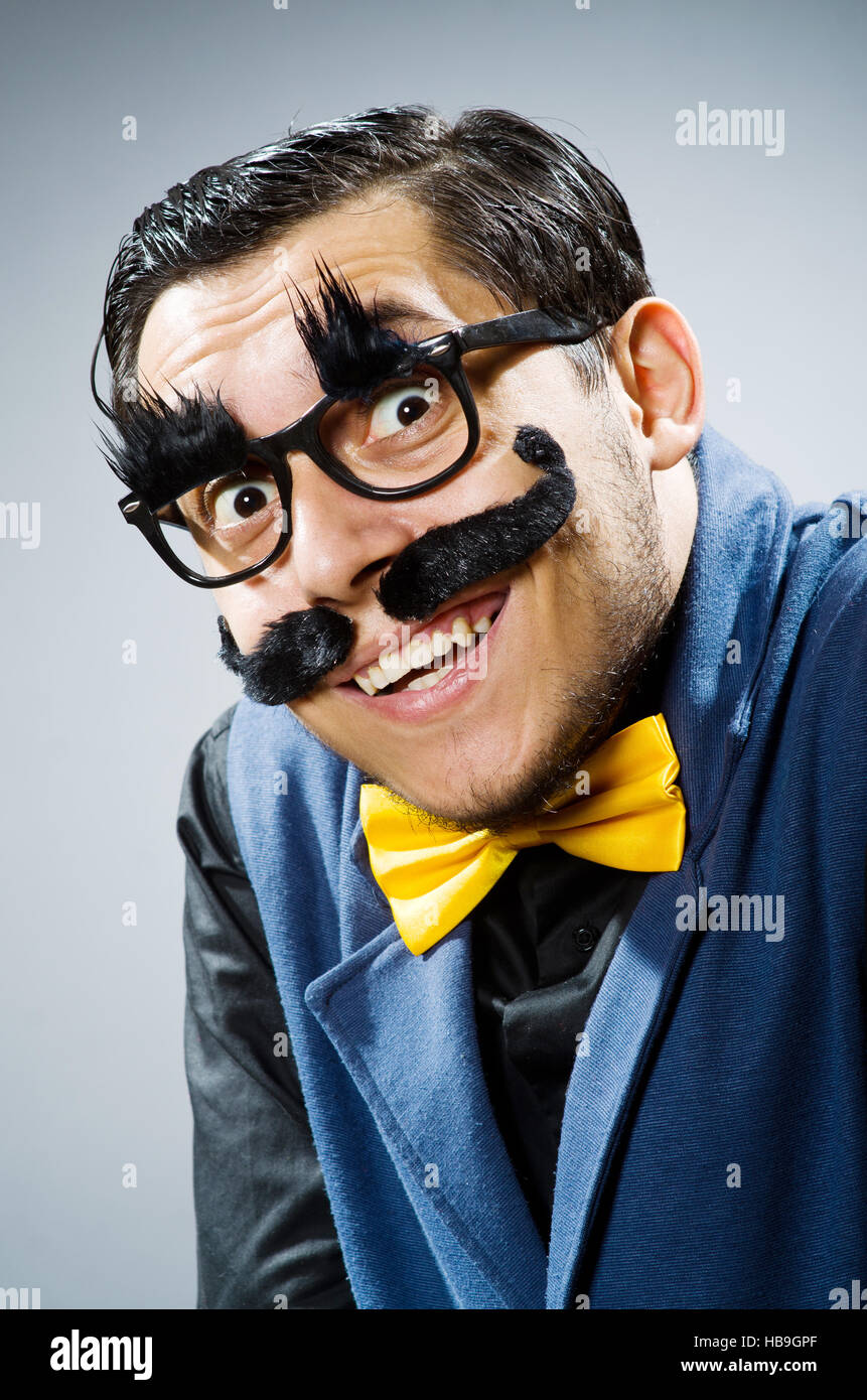 Funny man against dark background Stock Photo - Alamy