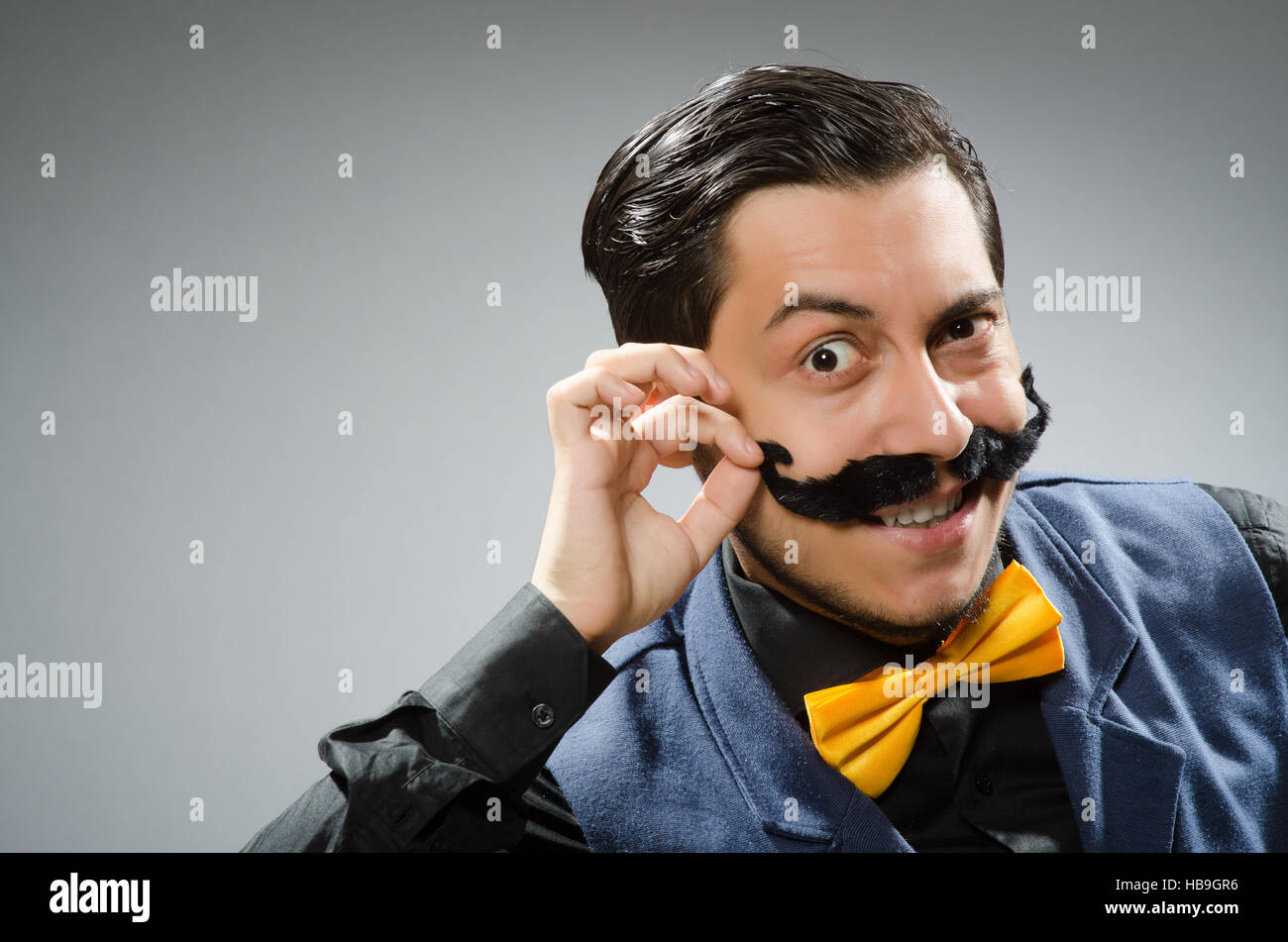 Funny man against dark background Stock Photo - Alamy