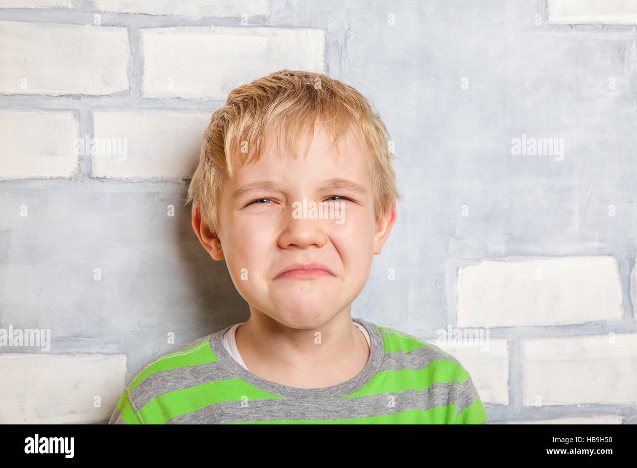 Portrait of adorable sad funny child Stock Photo - Alamy