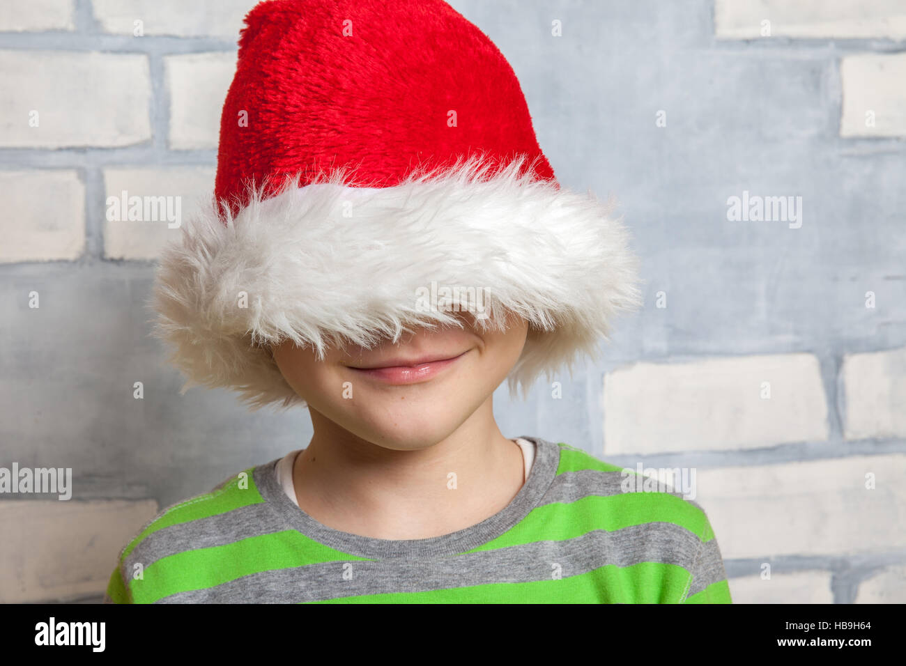 Little boy with Santa hat Stock Photo - Alamy