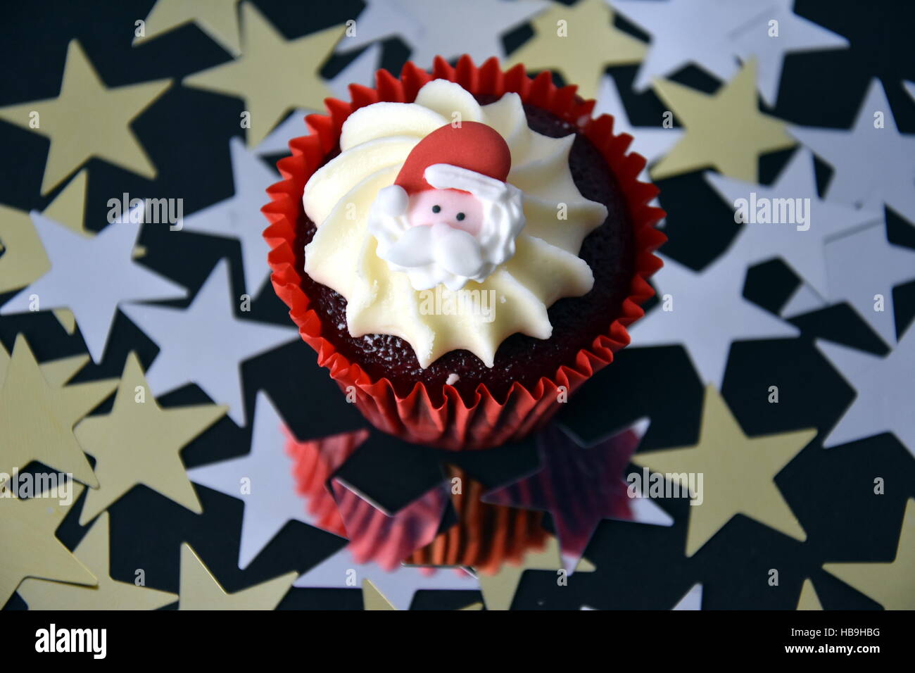 Christmas cupcake with Santa face and whipped cream topping. Xmas ...