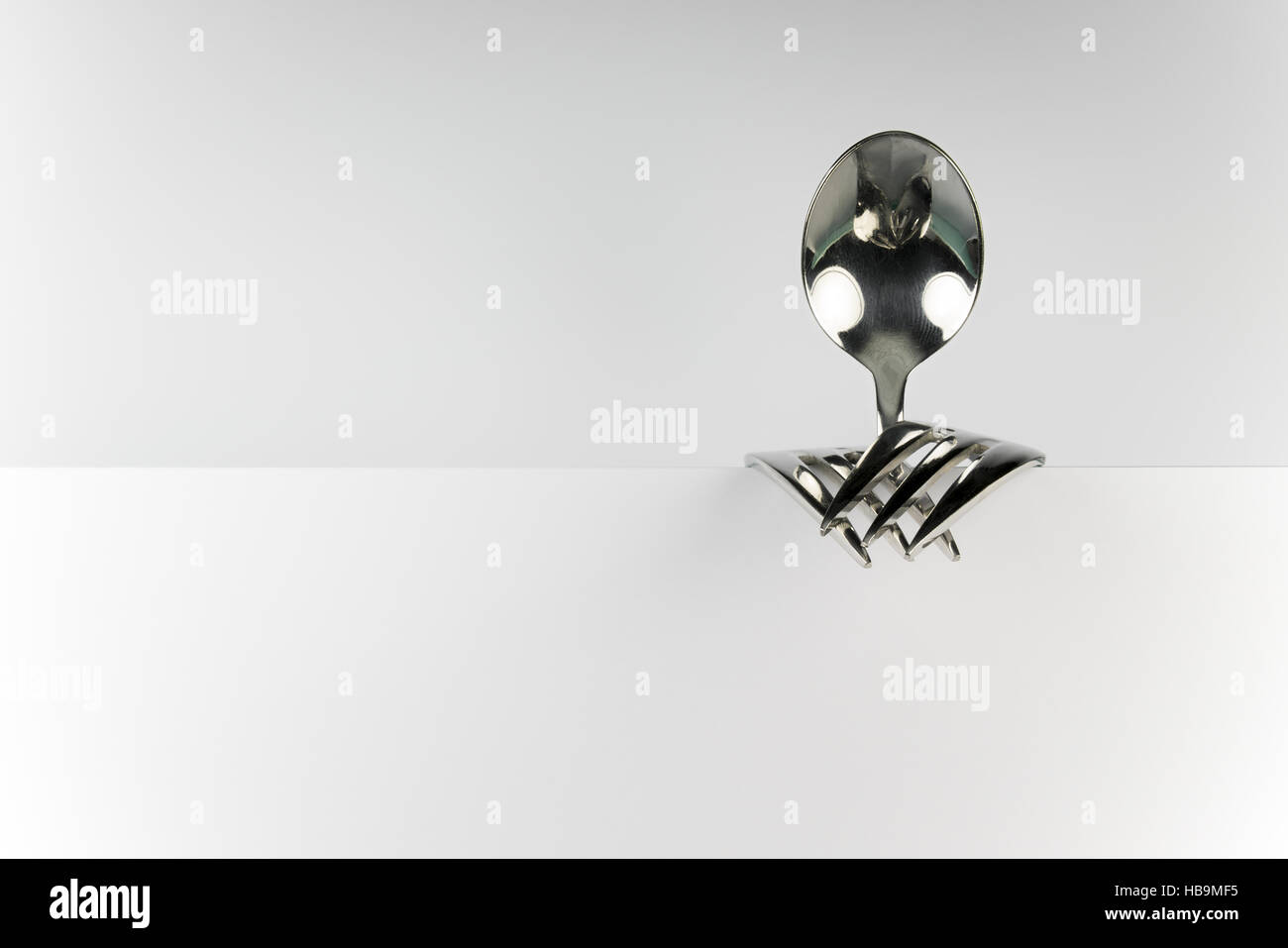 Figure of spoon and two forks Stock Photo - Alamy