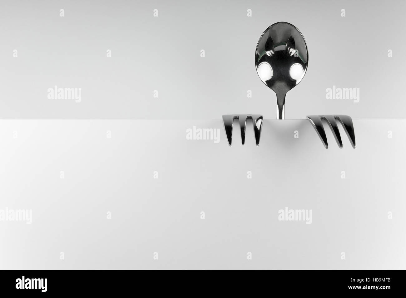 Figure of spoon and two forks Stock Photo - Alamy