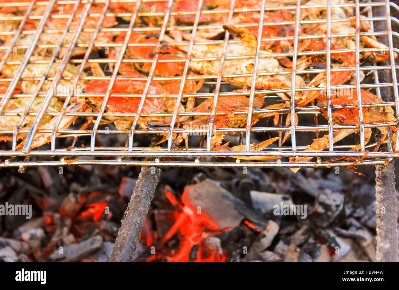 Grilled crab on flaming grill Stock Photo - Alamy