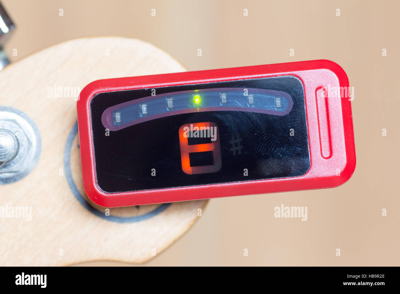 Series of tuning a guitar, F, accurate tuning by a digital tuner Stock ...