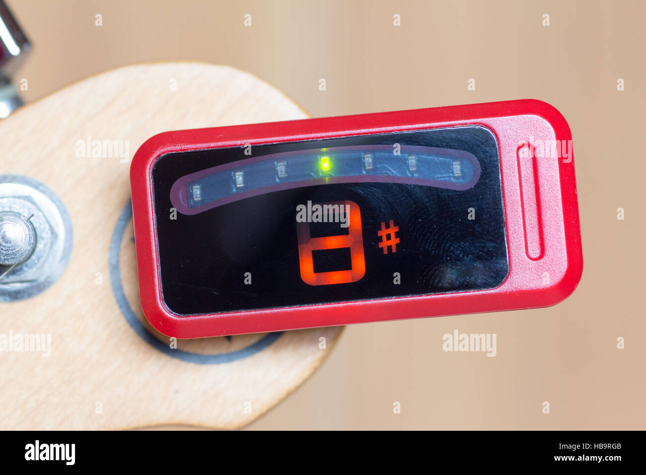 Series of tuning a guitar, D#, accurate tuning by a digital tuner Stock ...