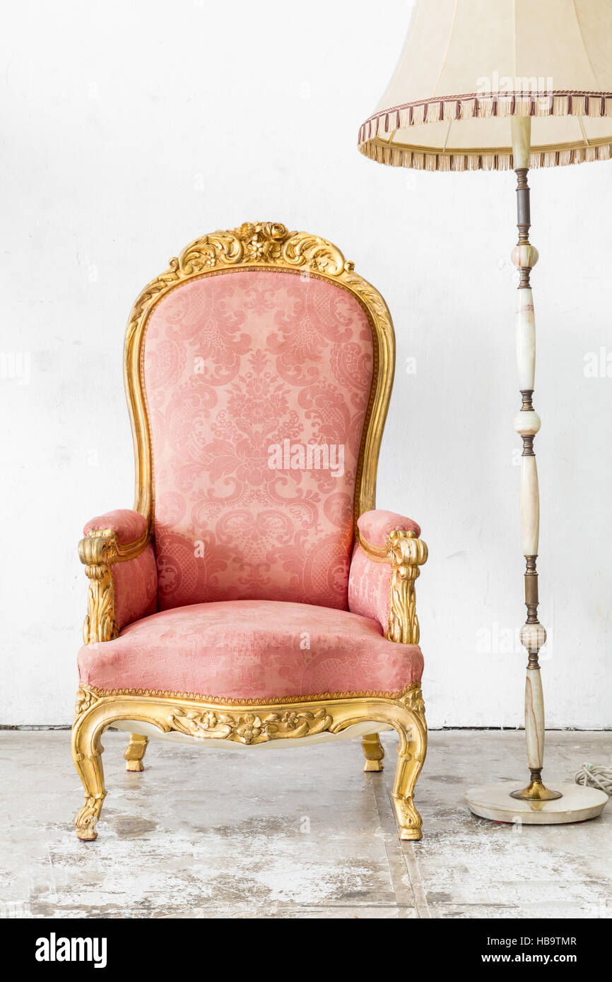 Pink Vintage Chair with lamp Stock Photo - Alamy