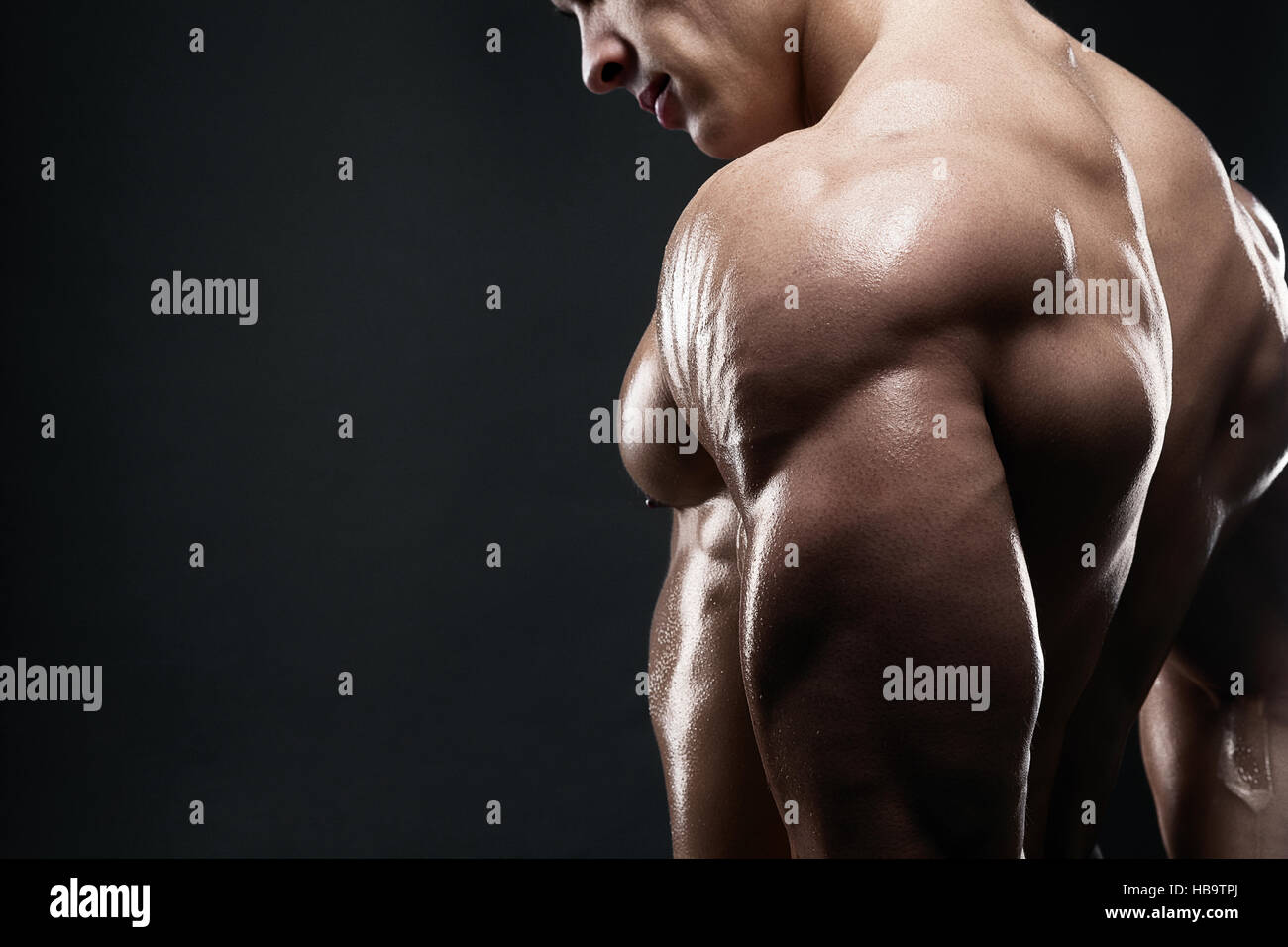 Muscled male model showing his back Stock Photo - Alamy