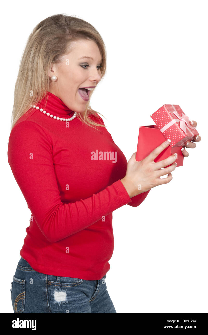 Beautiful woman opening a present Stock Photo - Alamy