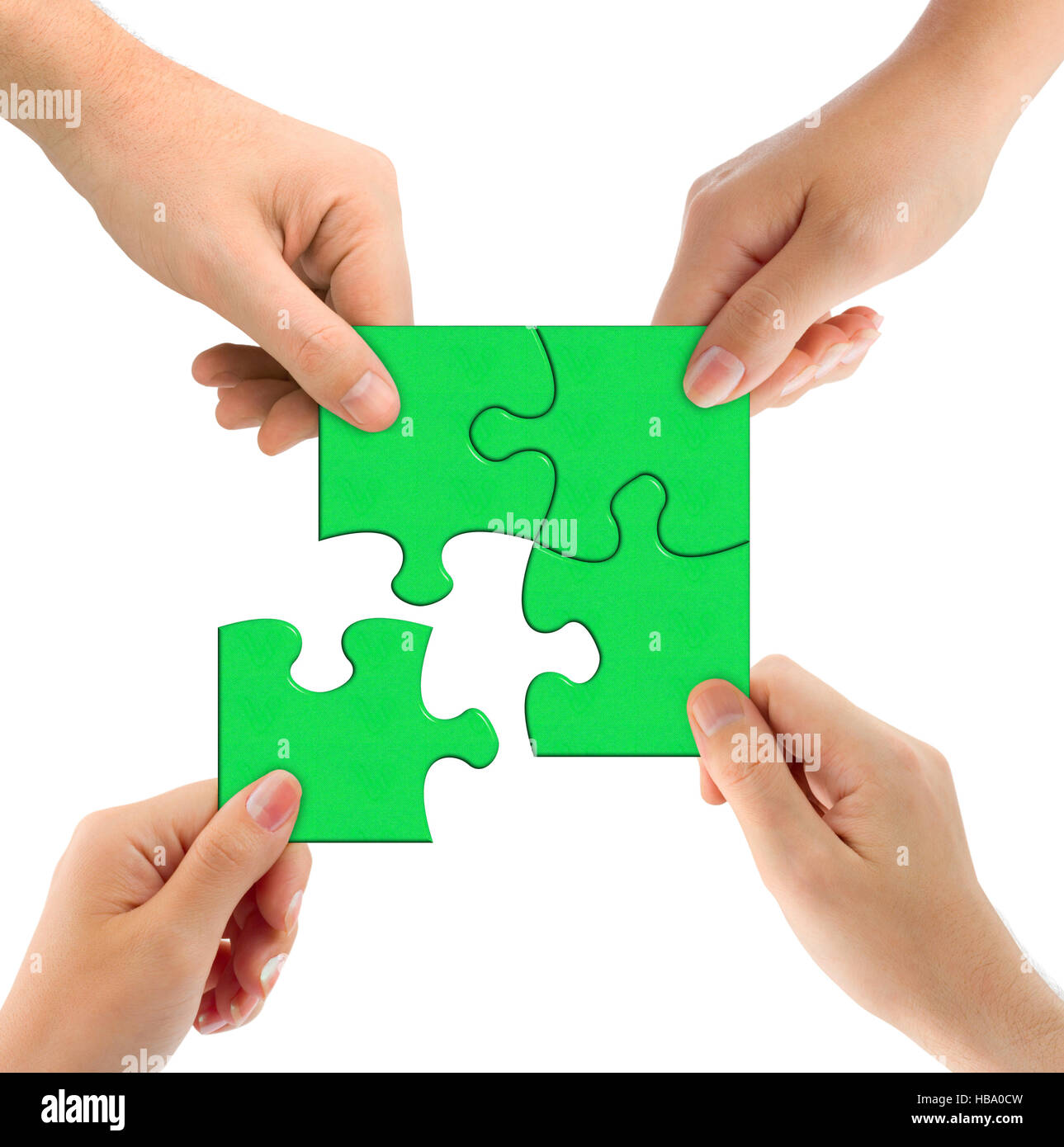 Hands and puzzle Stock Photo - Alamy